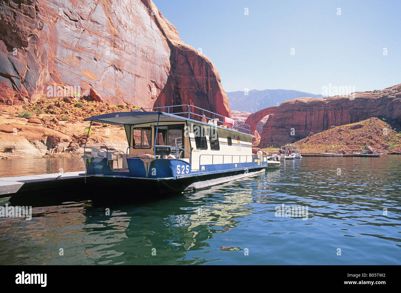A small rental houseboat moored at a marina near Rainbow Bridge Stock ...