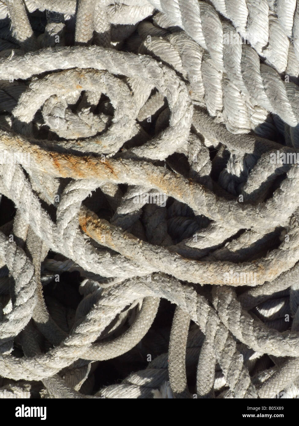 bundle of ropes in port Stock Photo - Alamy