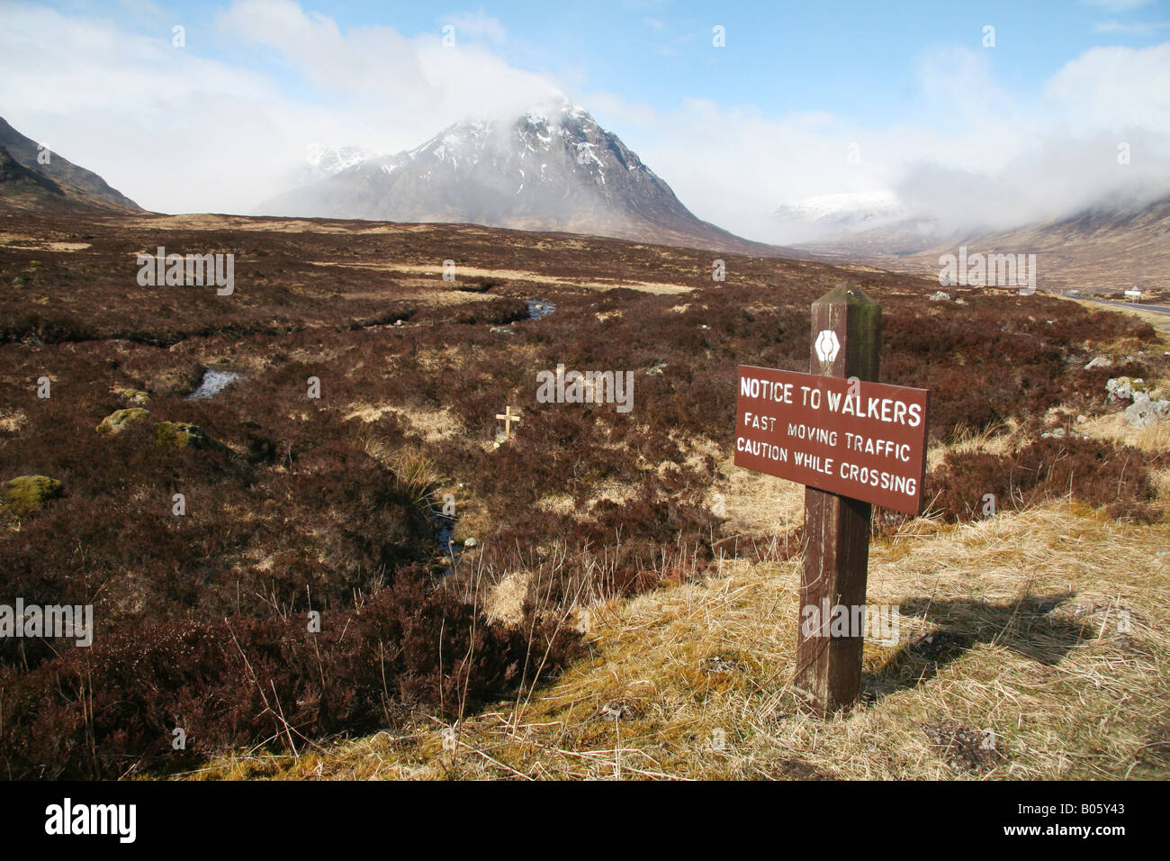 A signpost warning walkers of danger against a dramatic view in Glencoe ...