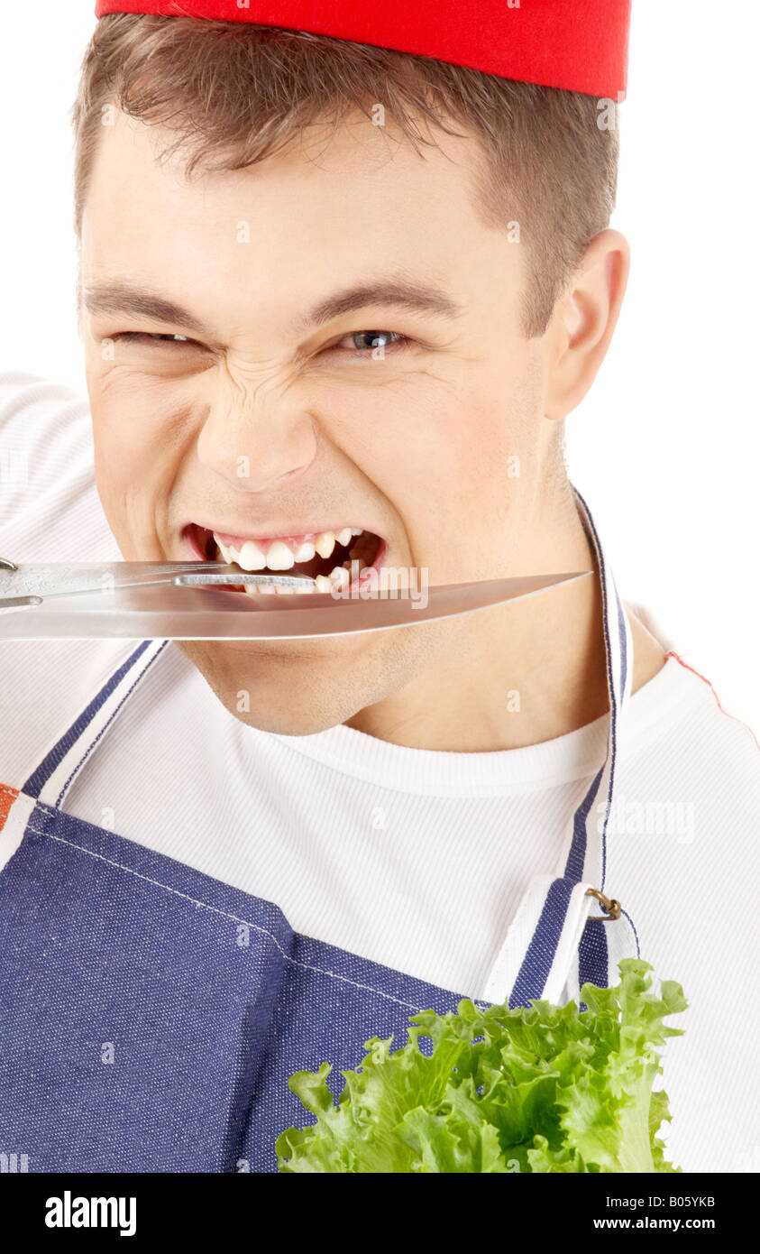 cook in turkish fez with big knife and green lettuce Stock Photo - Alamy
