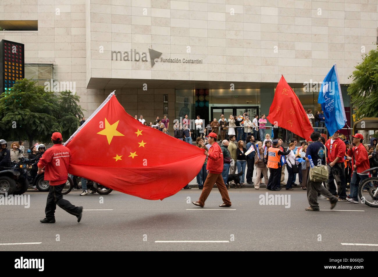 Chinese fans run past the Malba modern art museum in Buenos Aires ...