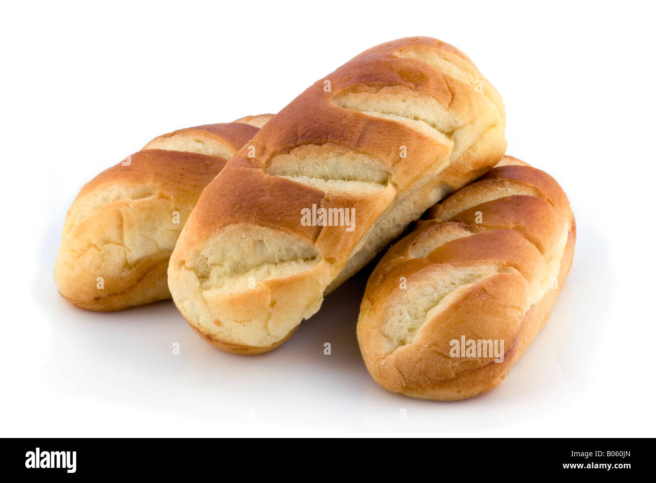 Three mini brioche on white Three mini brioche rolls on a clean white ...