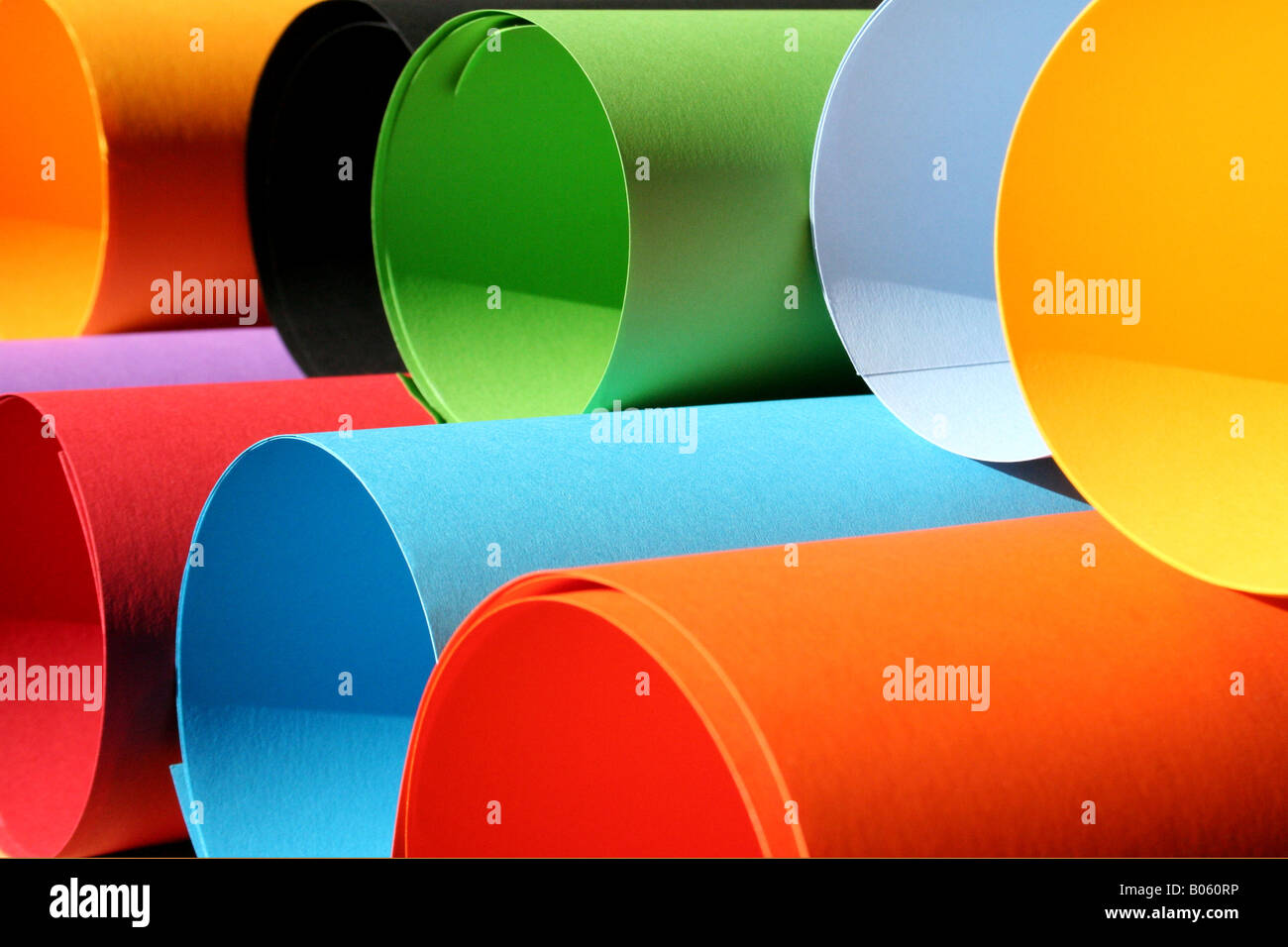 Rolls of colourful paper stacked together Stock Photo - Alamy