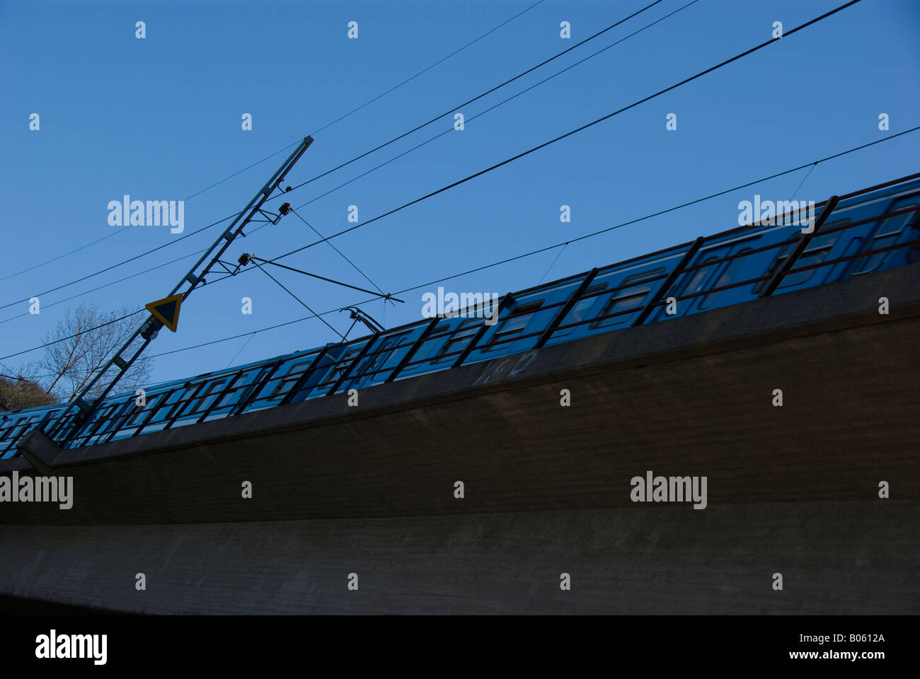 Subway trails going overhead on a bridge Stock Photo - Alamy