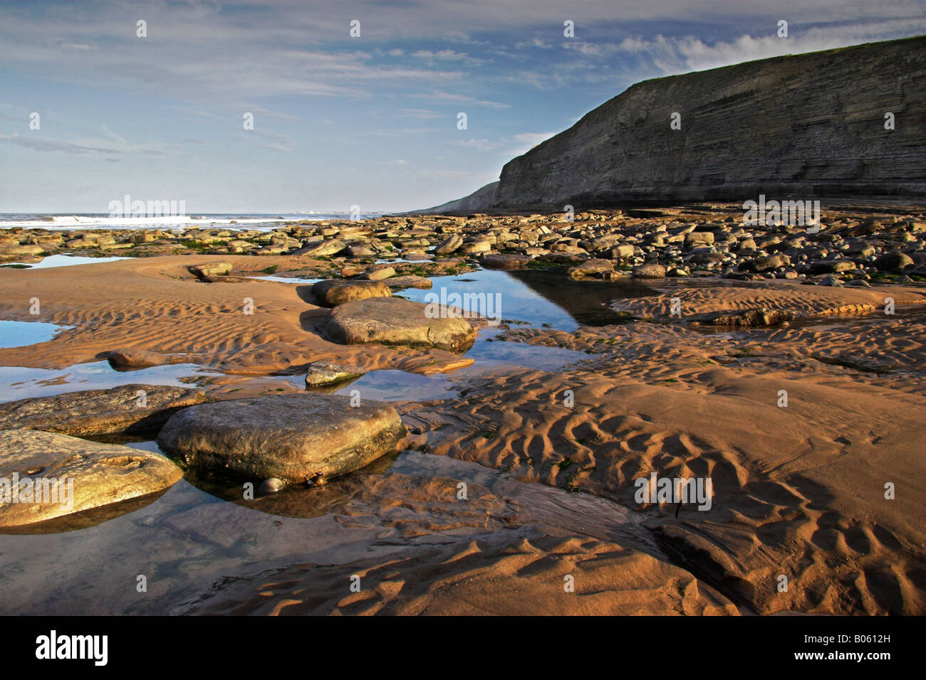 Rock Pools and Ripples In The SandOn Southerndown Beach Stock Photo - Alamy