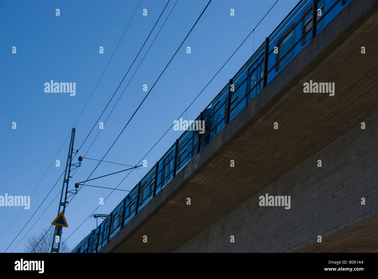 Subway trails going overhead on a bridge Stock Photo - Alamy