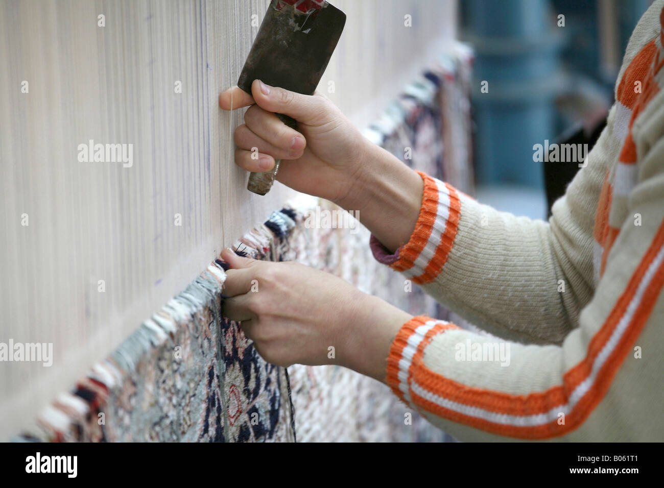 fast hands make a rug in a silk rug factory in Beijing, China Stock ...