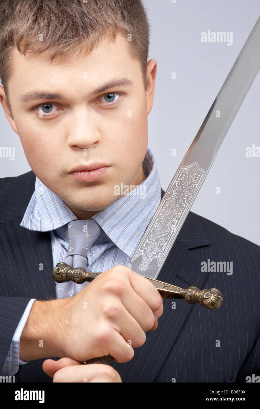 portrait of aggressive corporate worker with sword Stock Photo - Alamy