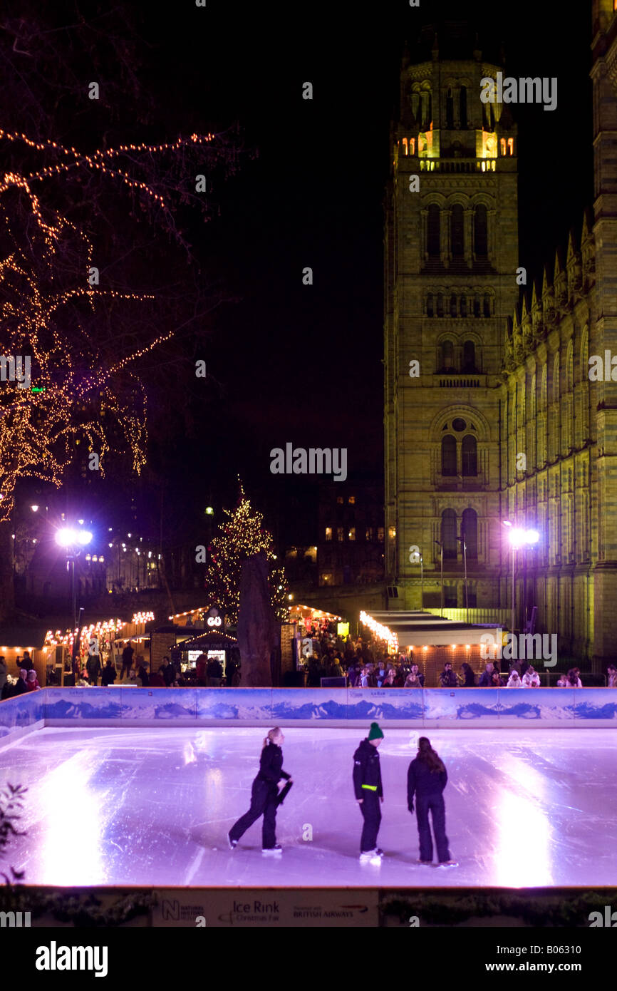 Natural History Museum London winter open air skating rink with staff ...