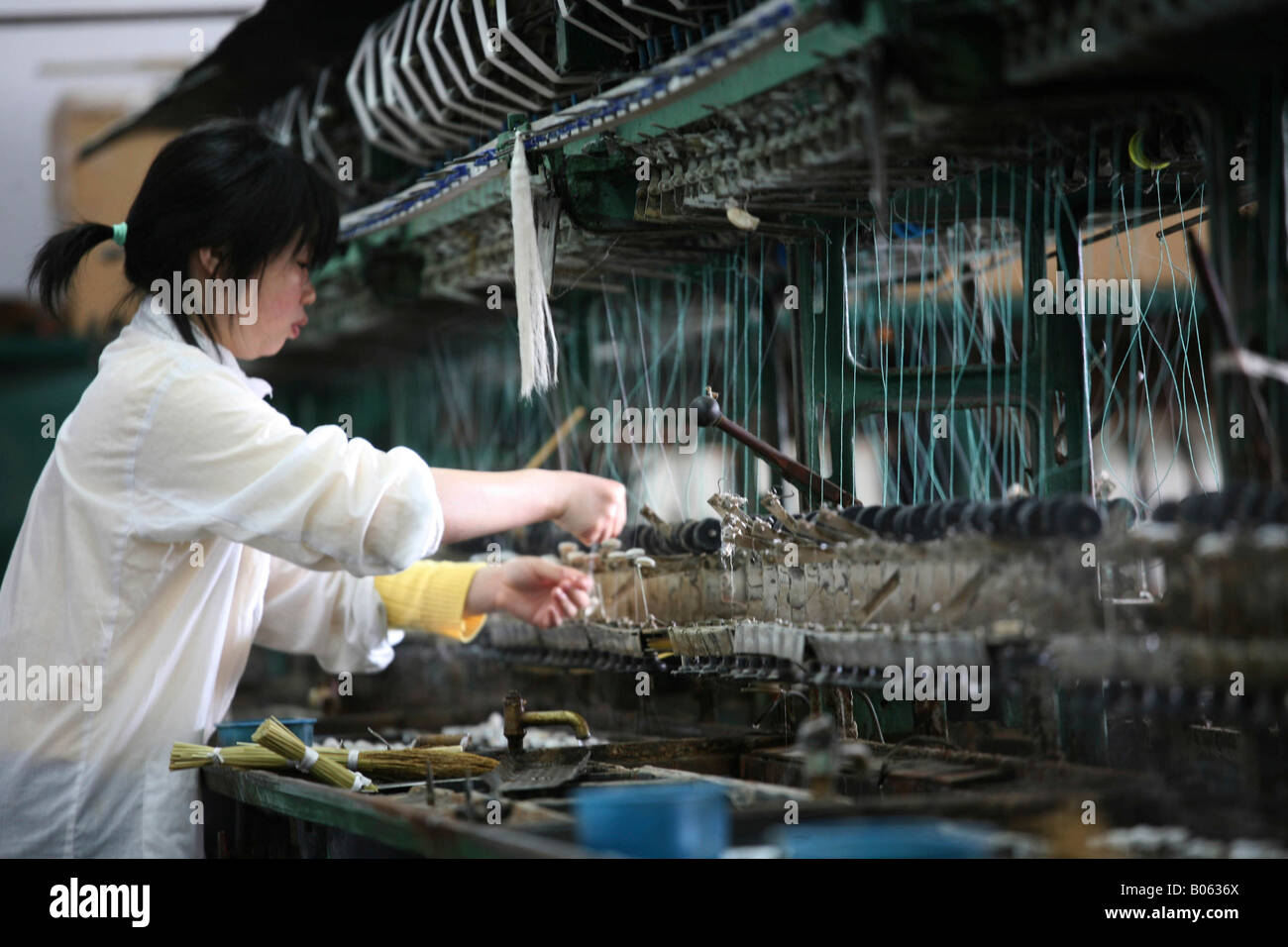 Worker in a silk factory hi-res stock photography and images - Alamy