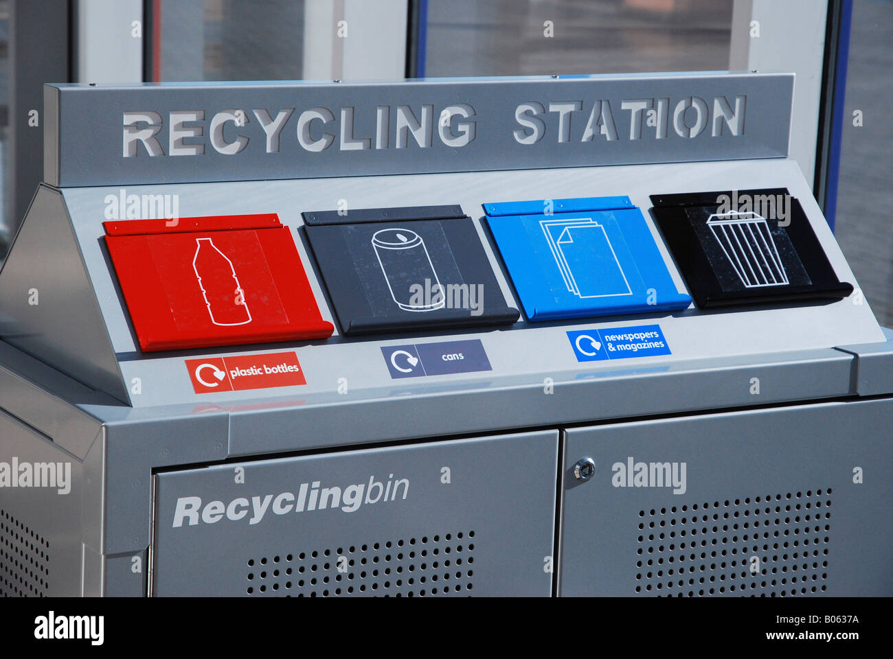 Waste recycling bin with multiple sections for different materials ...