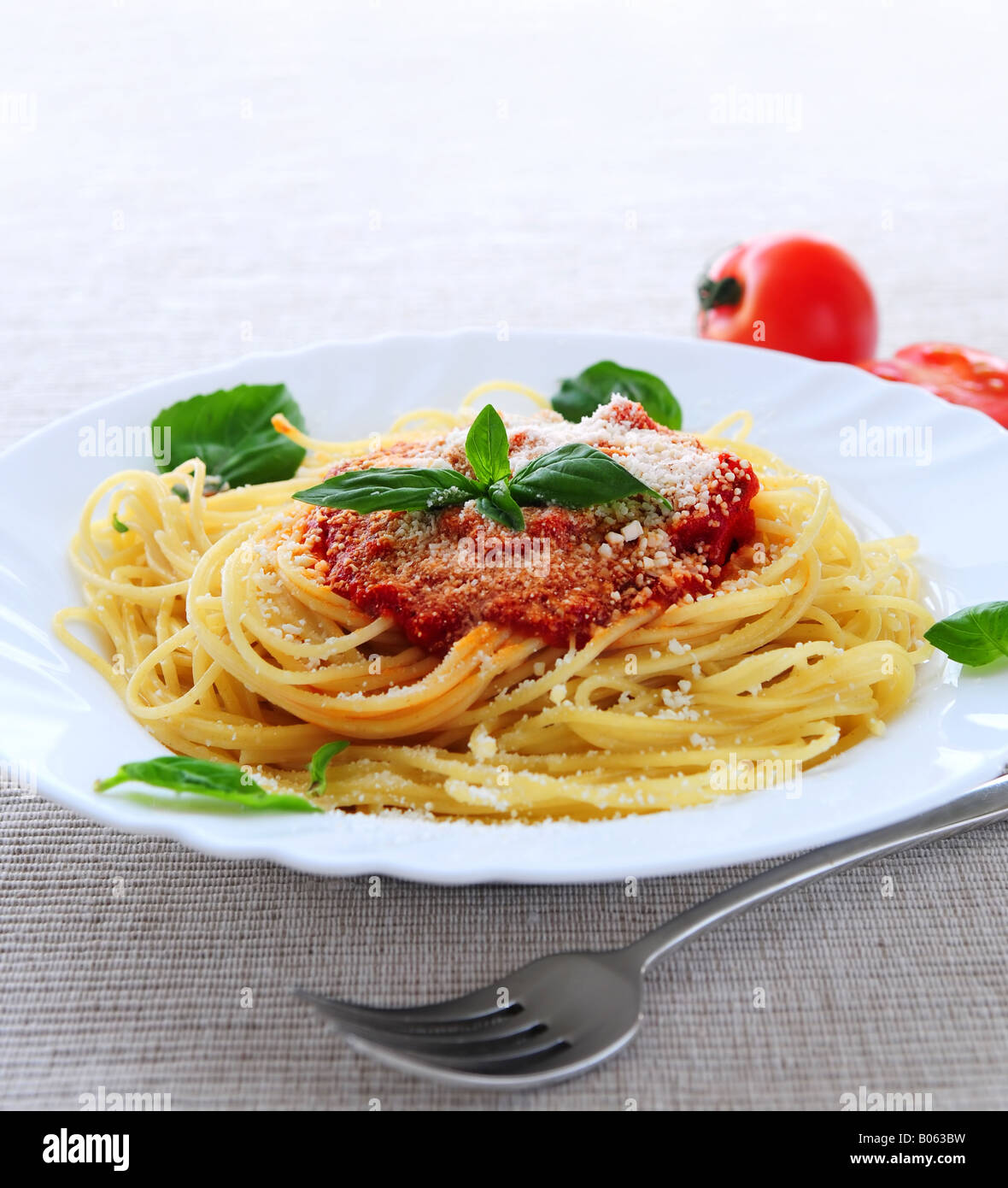 Big plate of pasta with tomato sauce and parmesan Stock Photo - Alamy