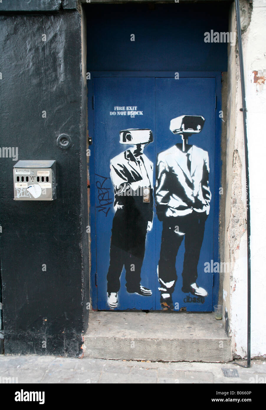 CCTV heads graffiti in Angel, London Stock Photo - Alamy