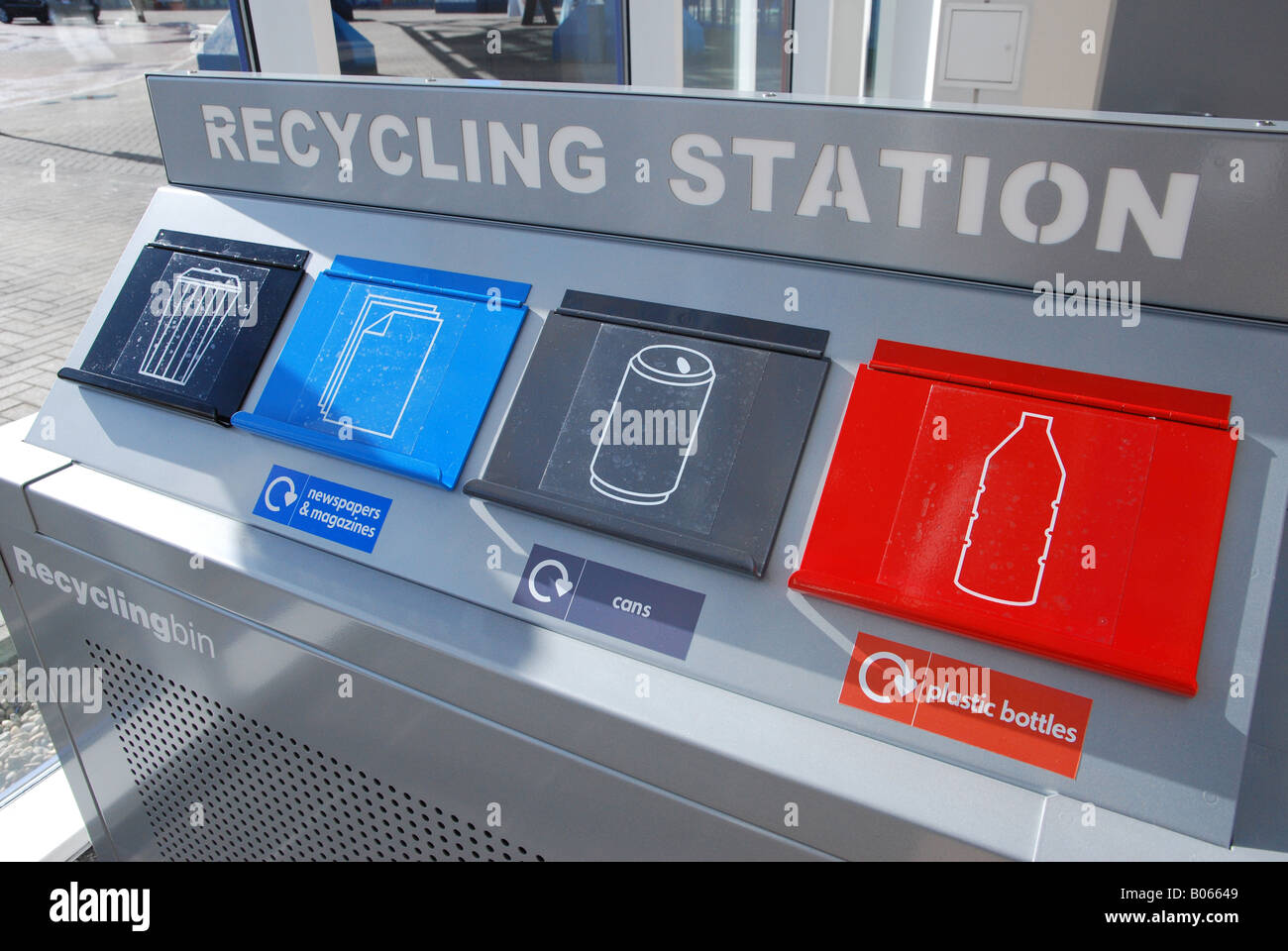 Waste recycling bin with multiple sections for different materials ...