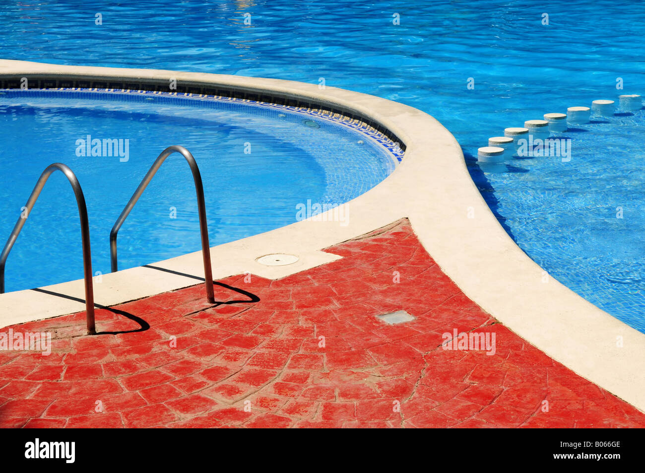 Detail of outdoor swimming pool at tropical resort Stock Photo - Alamy