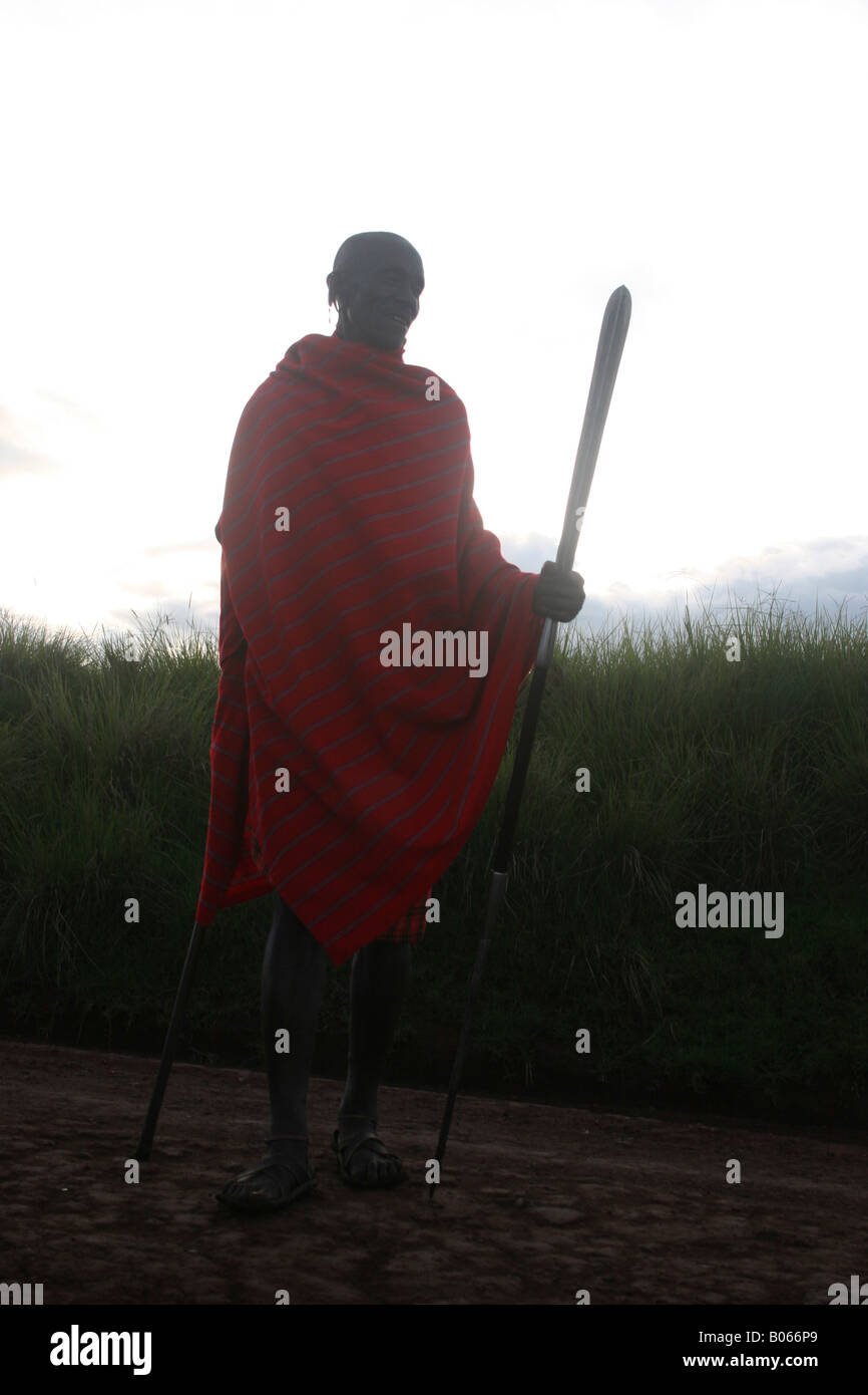 Africa Tanzania A silhouette of a Maasai Man with traditional staff in ...
