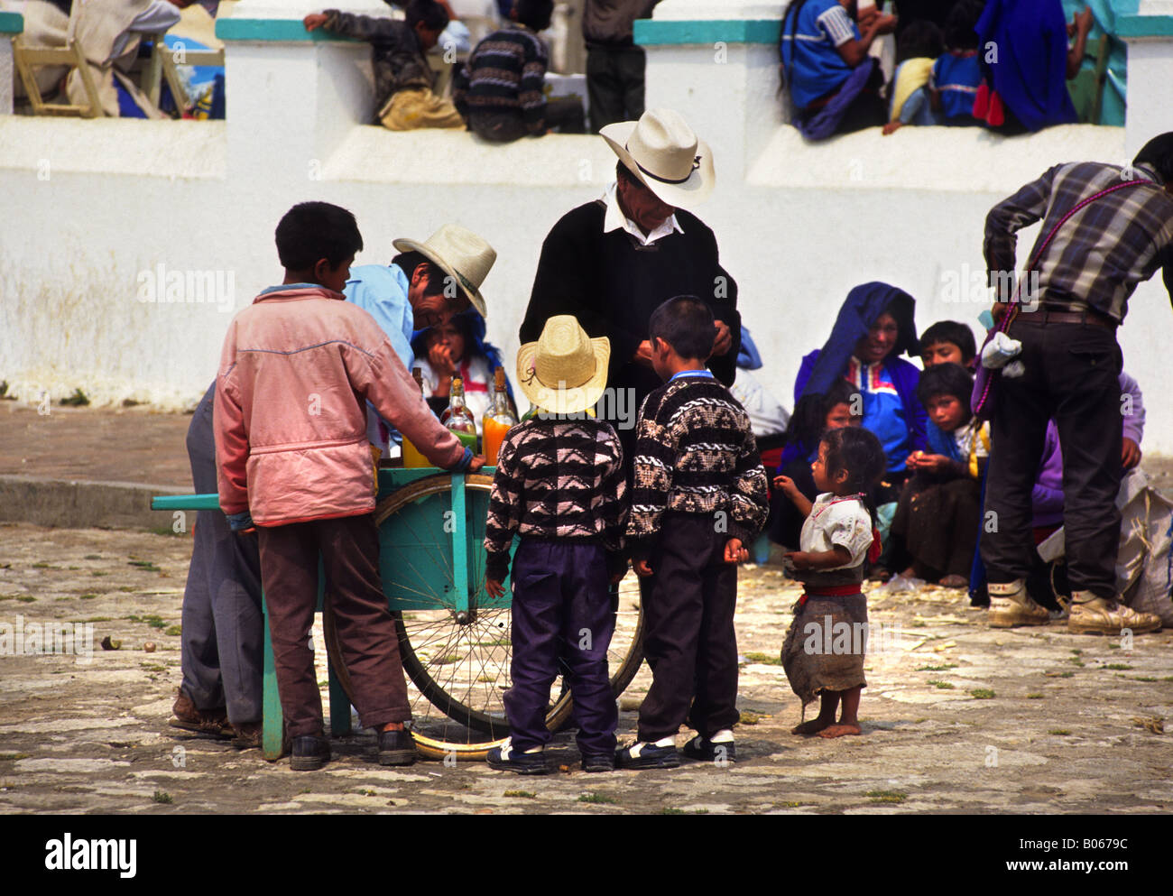 A CHAMULAN MAYAN MAN SERVING DRINKS FROM A TROLLEY AT THE MARKET IN SAN ...