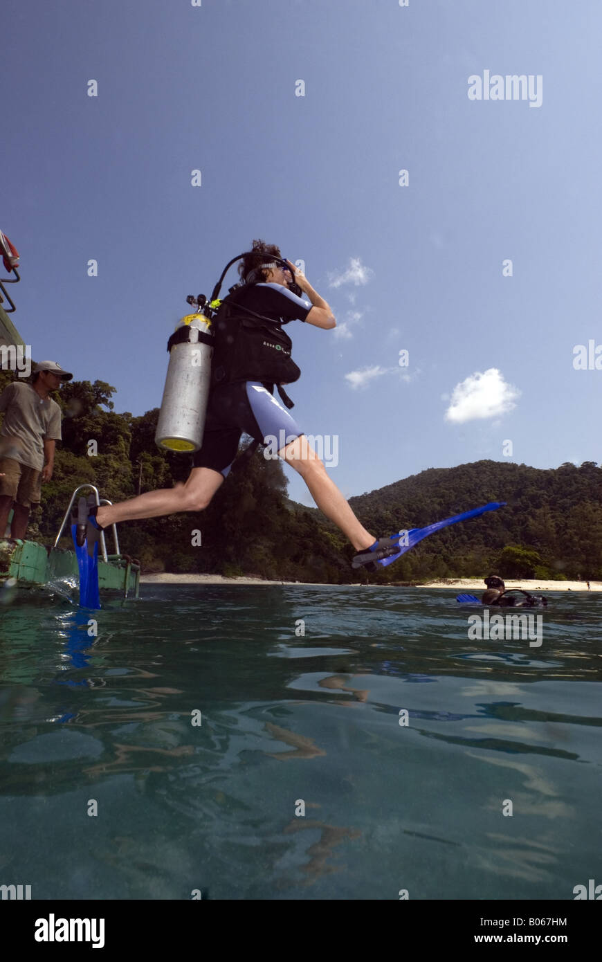 Diver entering water from underwater hi-res stock photography and ...
