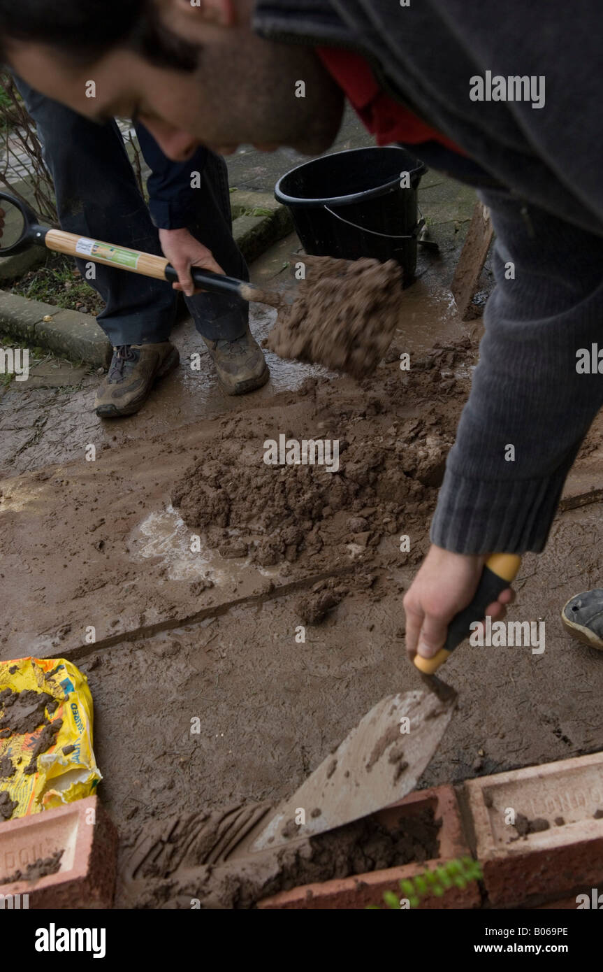 DIY How to build a brick wall Stock Photo - Alamy
