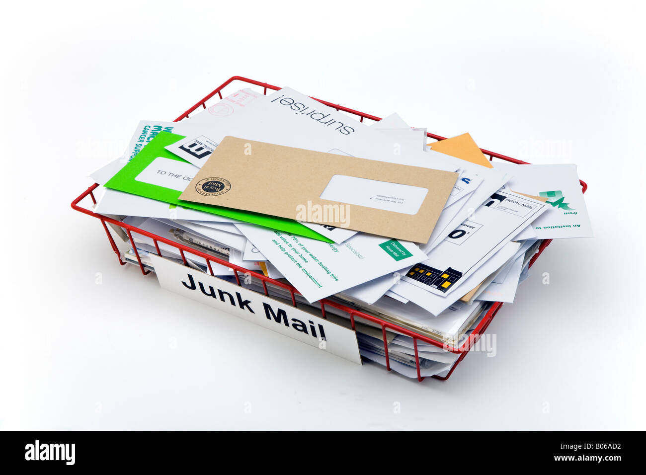 red wire mesh office post tray full of junk mail Stock Photo - Alamy