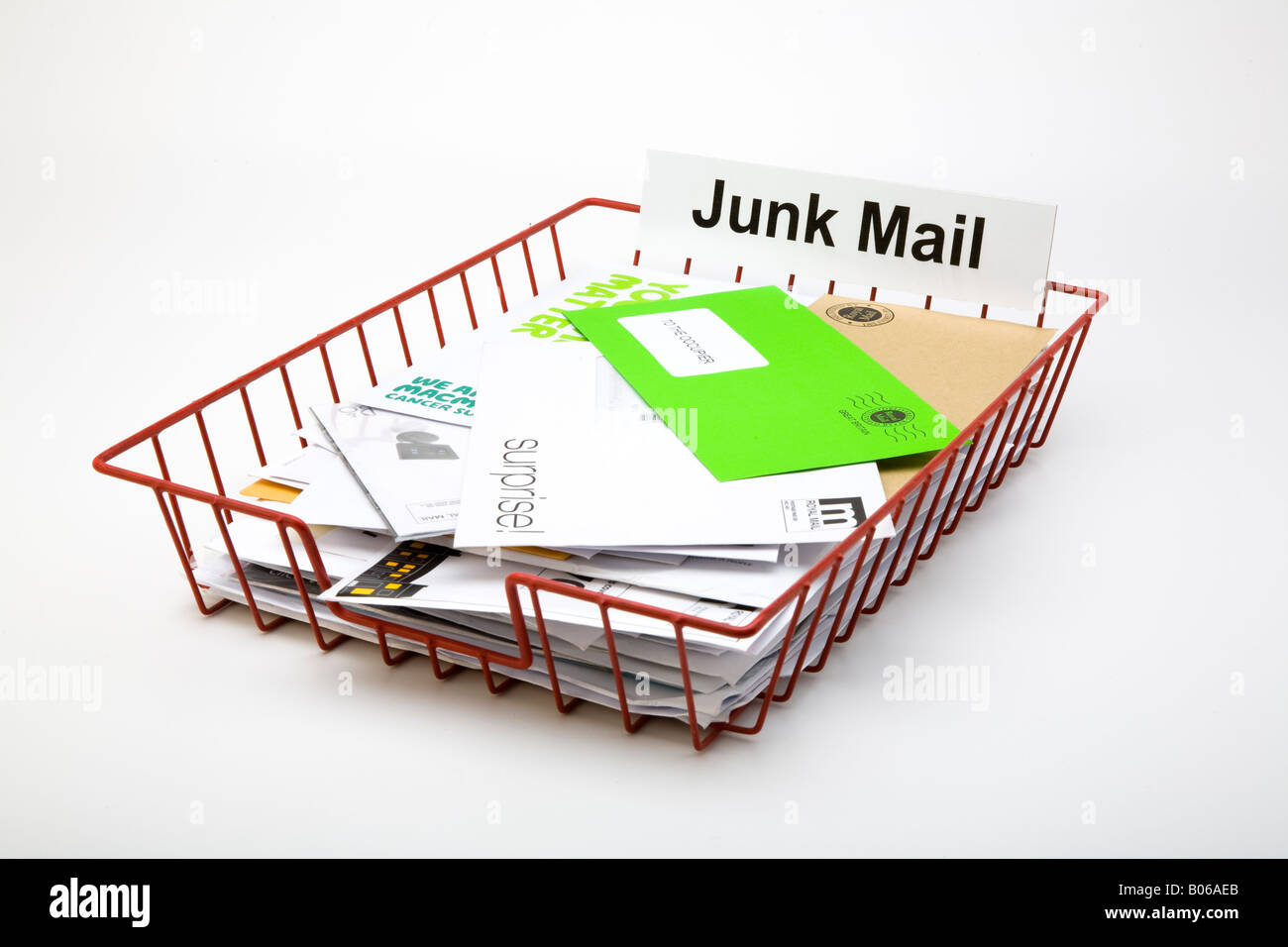 red wire mesh office post tray full of junk mail Stock Photo - Alamy