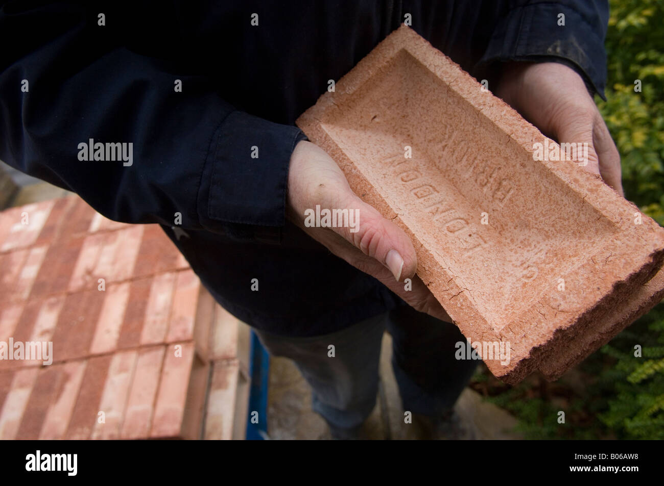 DIY How to build a brick wall Stock Photo - Alamy