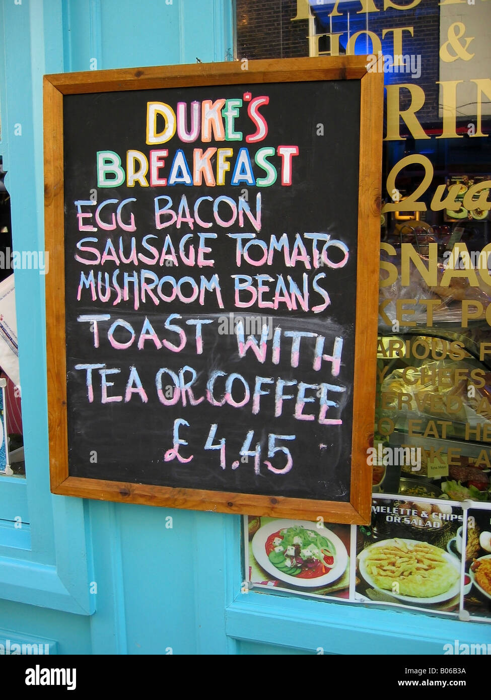 colorful blackboard outside London pub advertising breakfast with egg ...