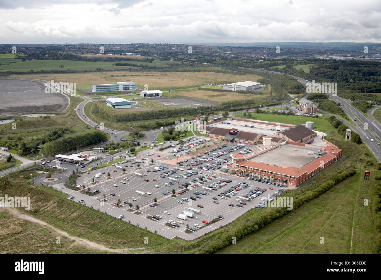 Aerial view south west of retail park Morrisons Supermarket and ...