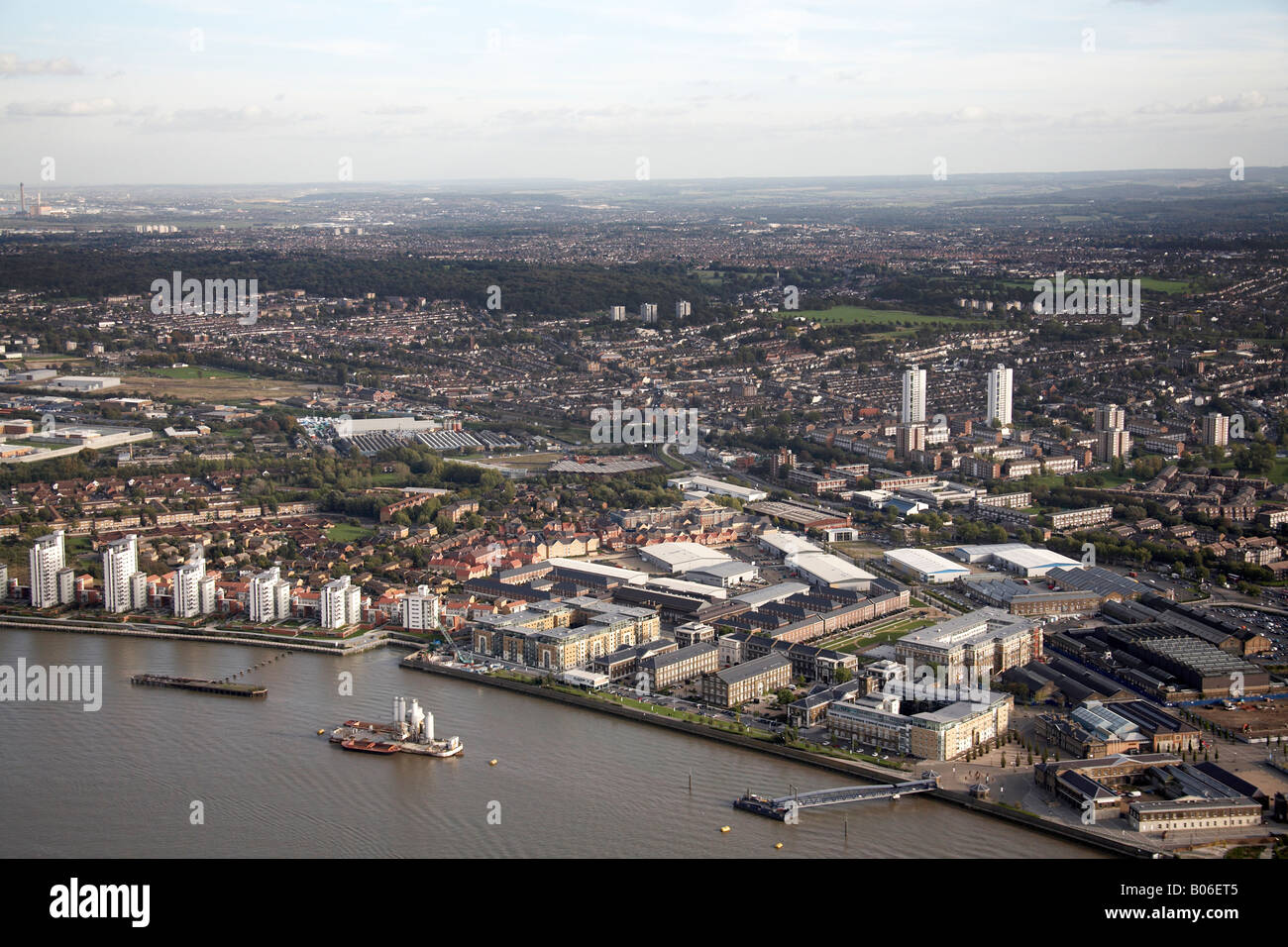 Aerial view south east of River Thames suburban houses tower blocks ...
