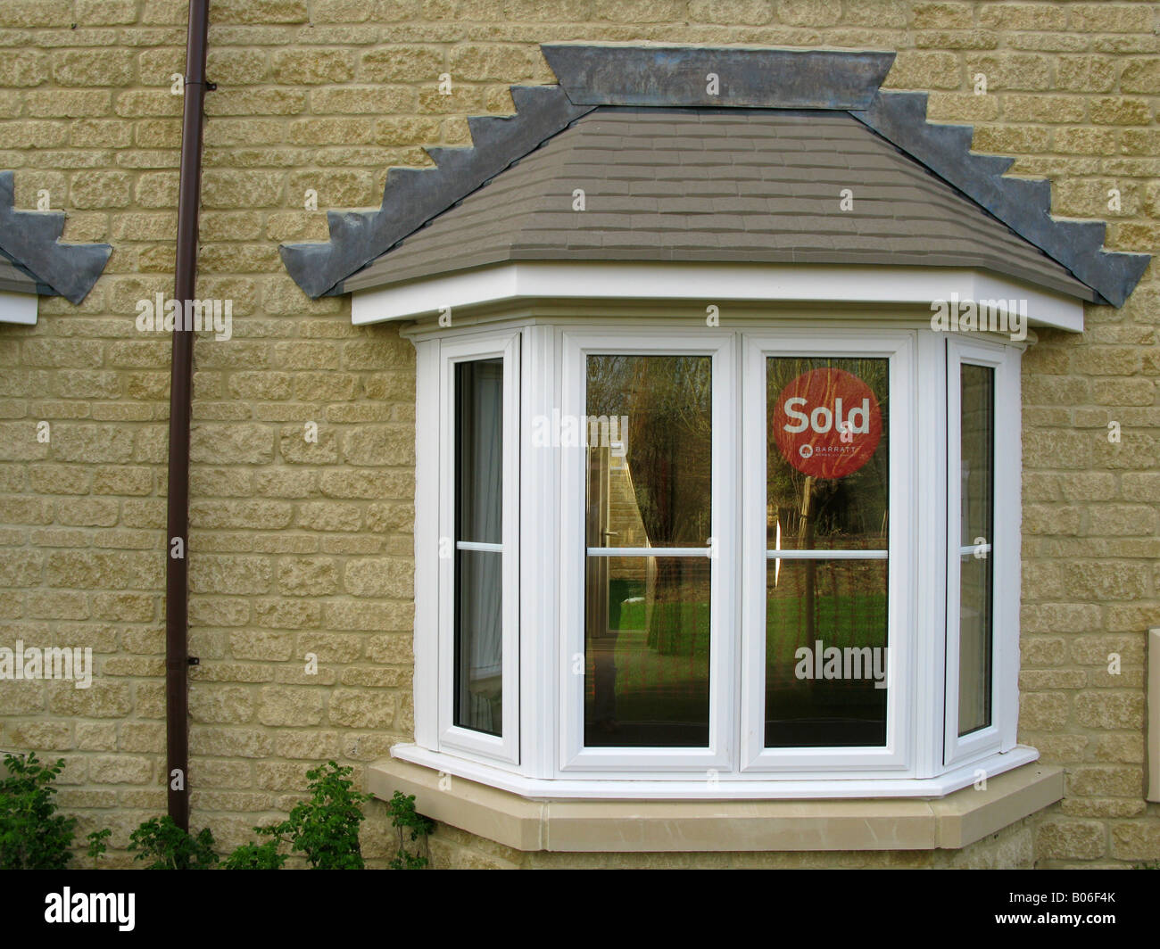 Sold sign in window of new build house, Witney, Oxfordshire Stock Photo ...