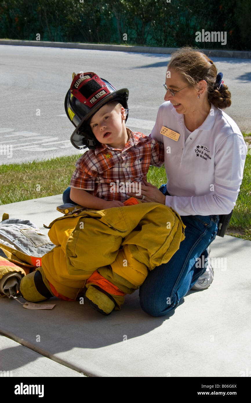 A Disabled Child Dressed up In a Fireman's Costume Stock Photo - Alamy