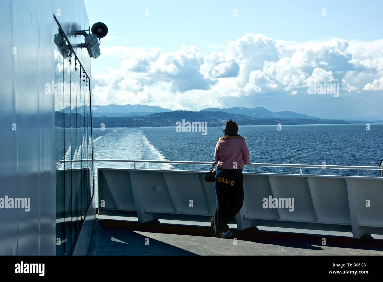 Passenger enjoying a sunny day while sailing across Georgia Strait ...