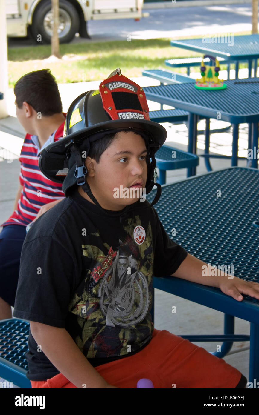 A Disabled Child Dressed up In a Fireman's Costume Stock Photo - Alamy