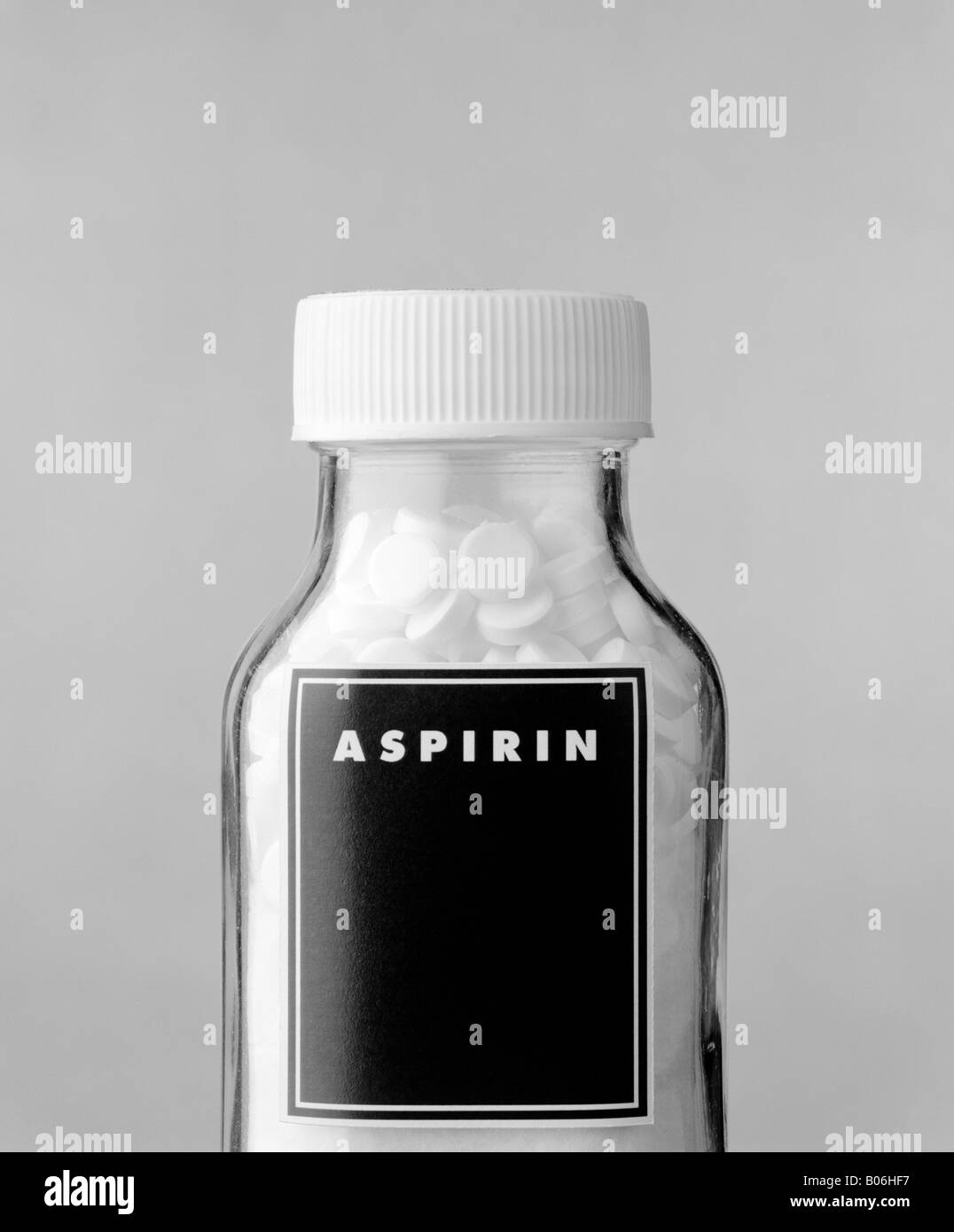 monochrome picture of a bottle of aspirin against a plain background ...