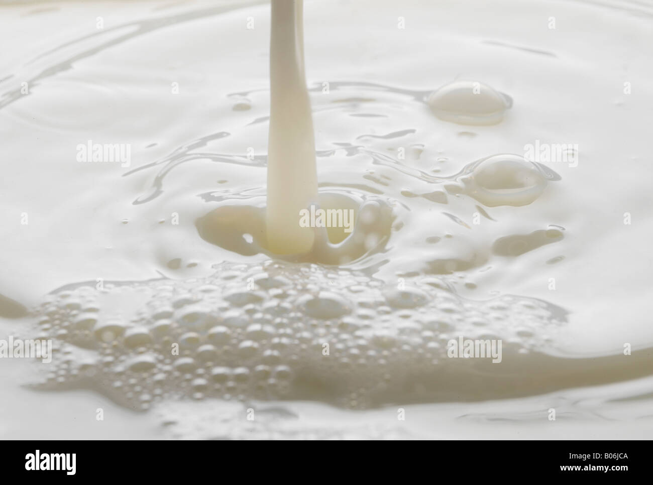 pouring white liquid Stock Photo - Alamy