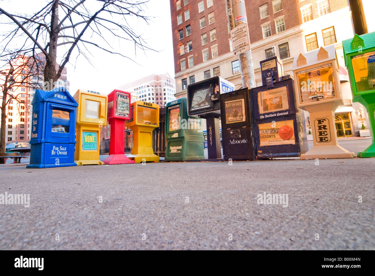 Newspaper dispensers on a city sidewalk Stock Photo - Alamy