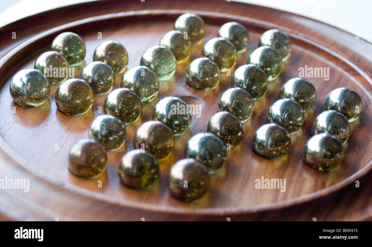 Glass marble solitaire board Stock Photo - Alamy
