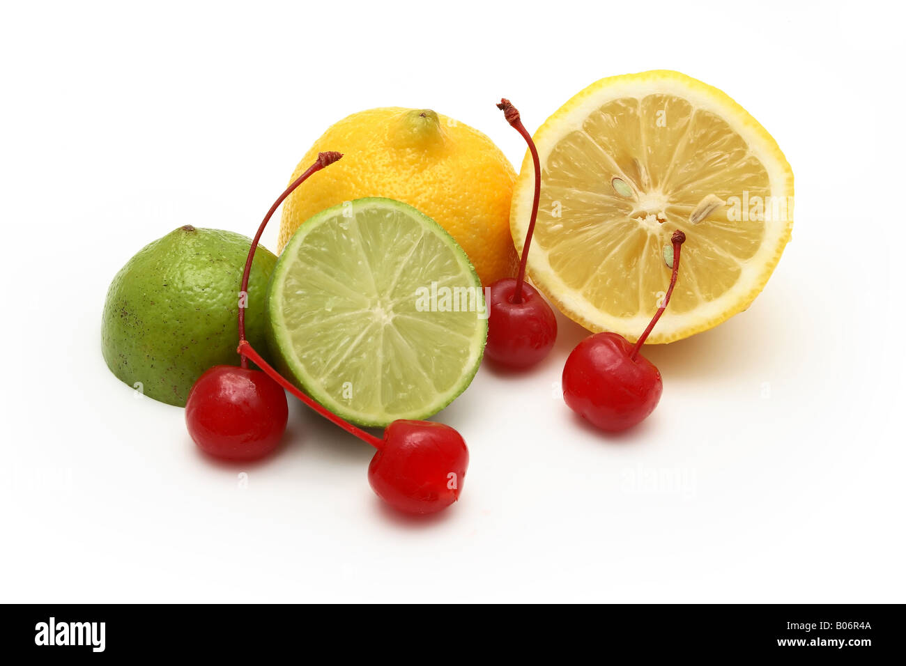 Lemons limes and cherries on a white background Stock Photo - Alamy