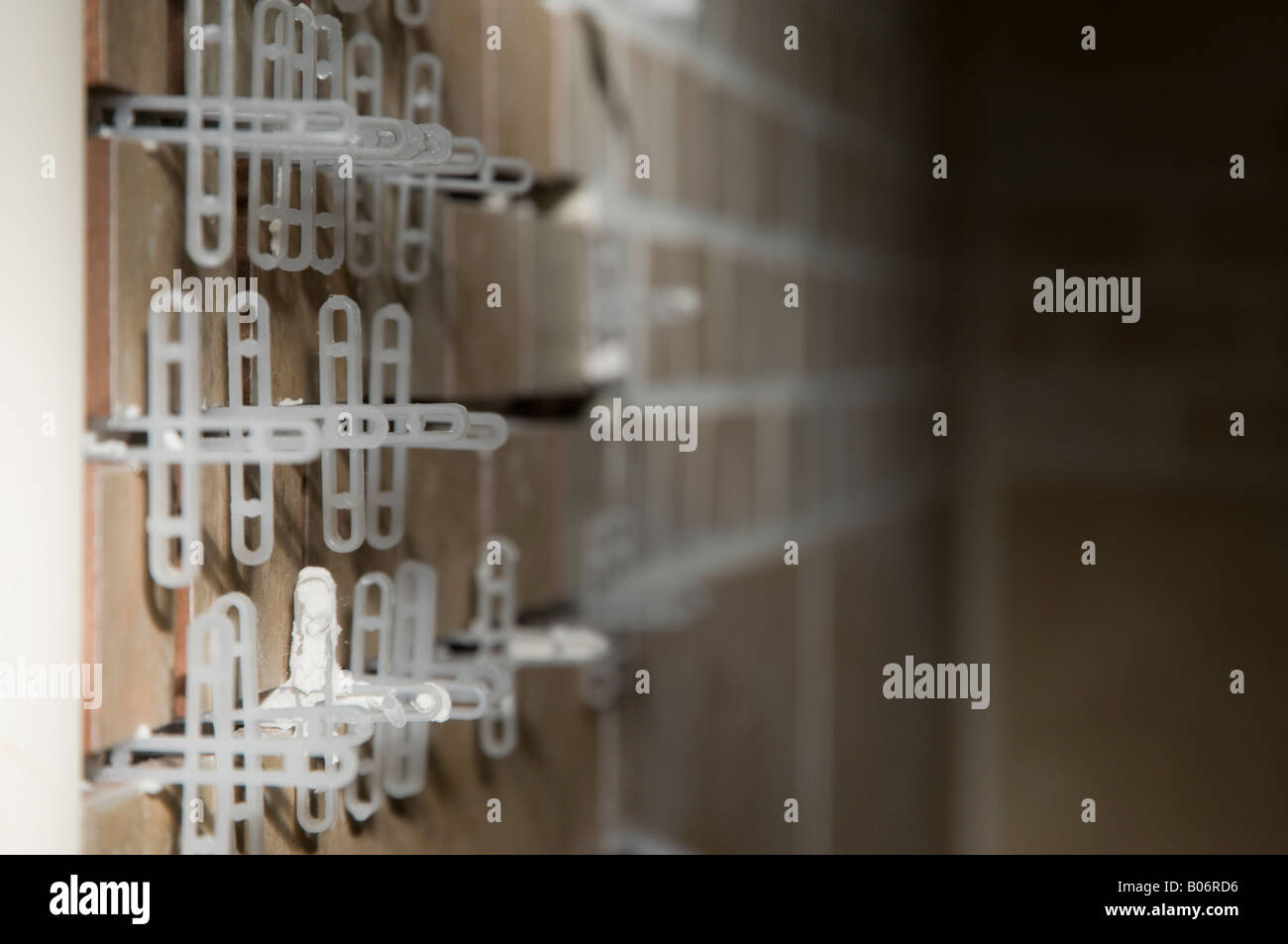 Tiling spacers inbetween mosaic tiles Stock Photo - Alamy