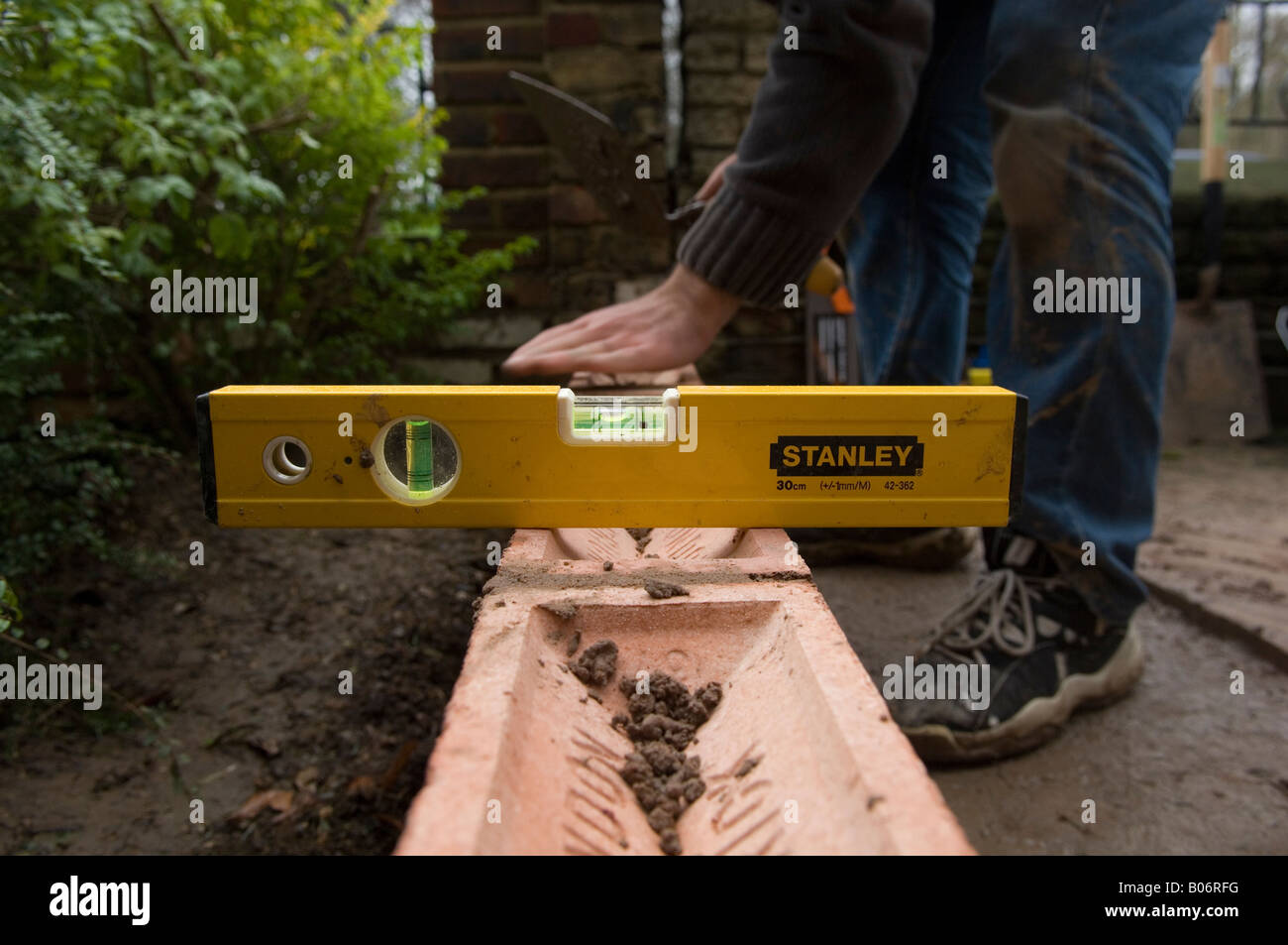 DIY How to build a brick wall Stock Photo - Alamy
