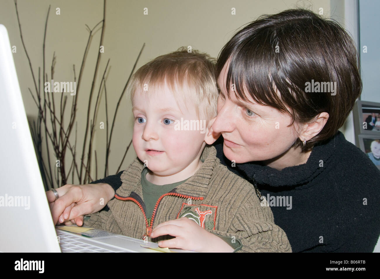 Mother and son using laptop computer Stock Photo - Alamy