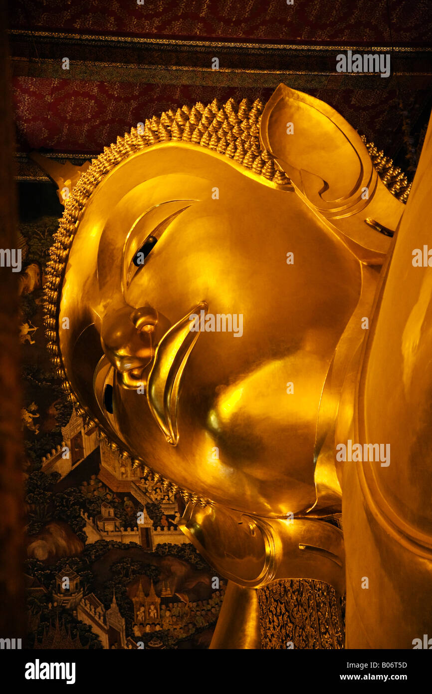 The gilded FACE of the largest RECLINING BUDDHA in THAILAND at the ...