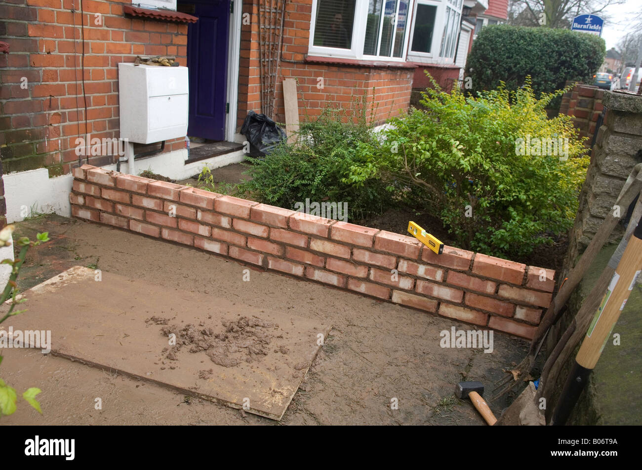 DIY How to build a brick wall Stock Photo - Alamy