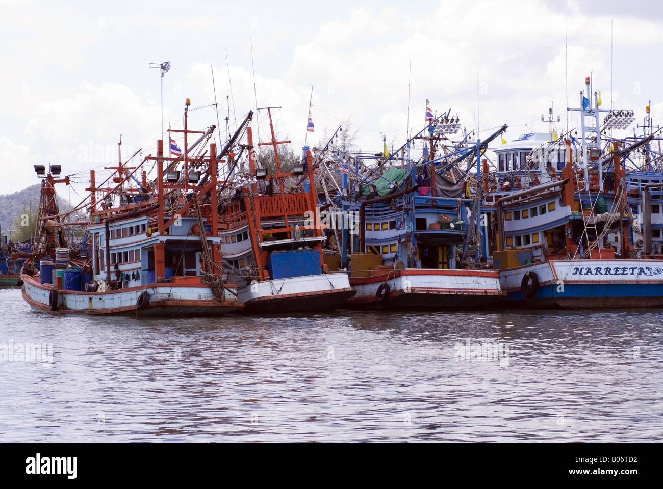Fishing boats in river harbour Stock Photo - Alamy