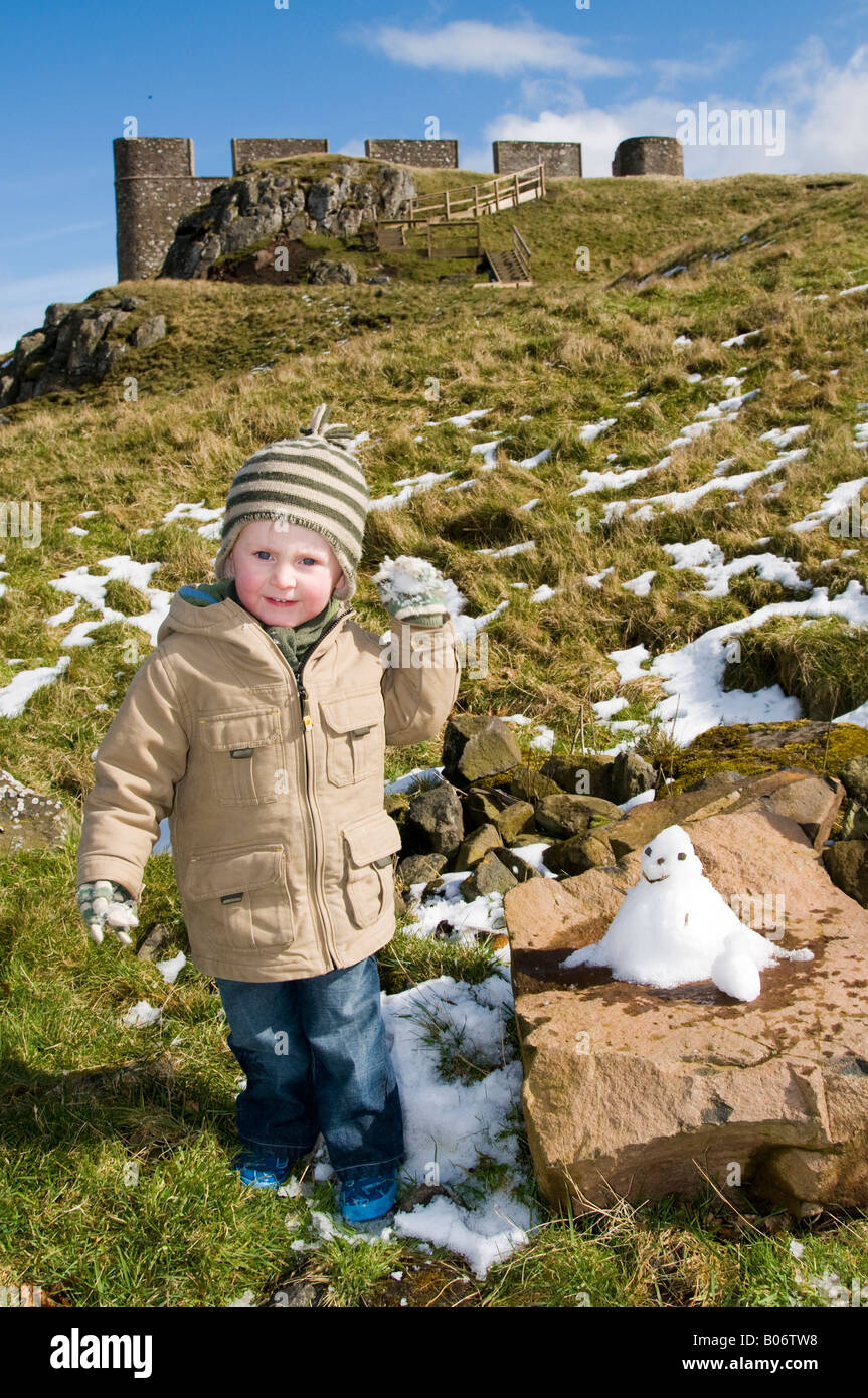 Boy in foregorund of Hume Castle Stock Photo - Alamy