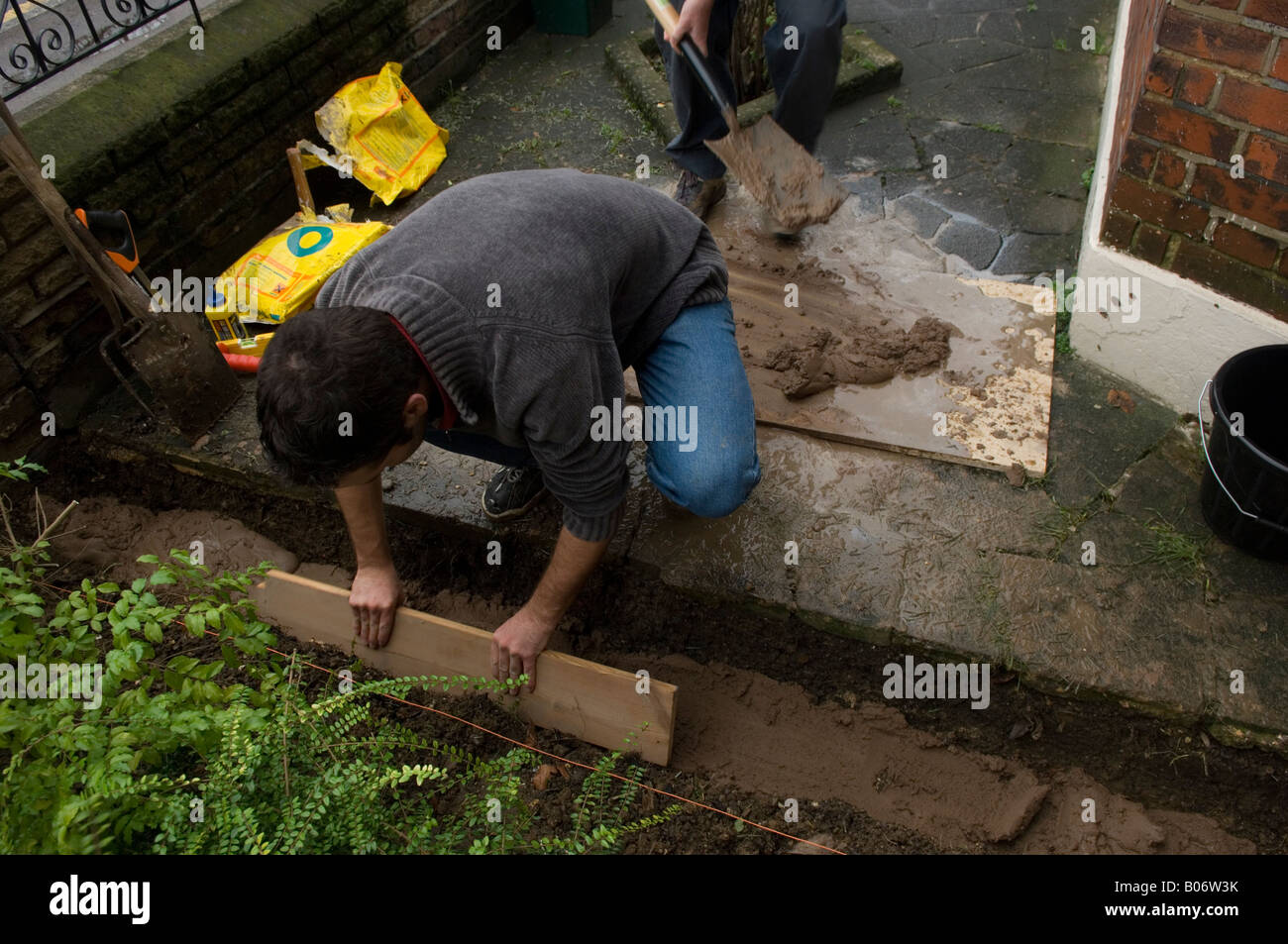 DIY How to build a brick wall Stock Photo - Alamy