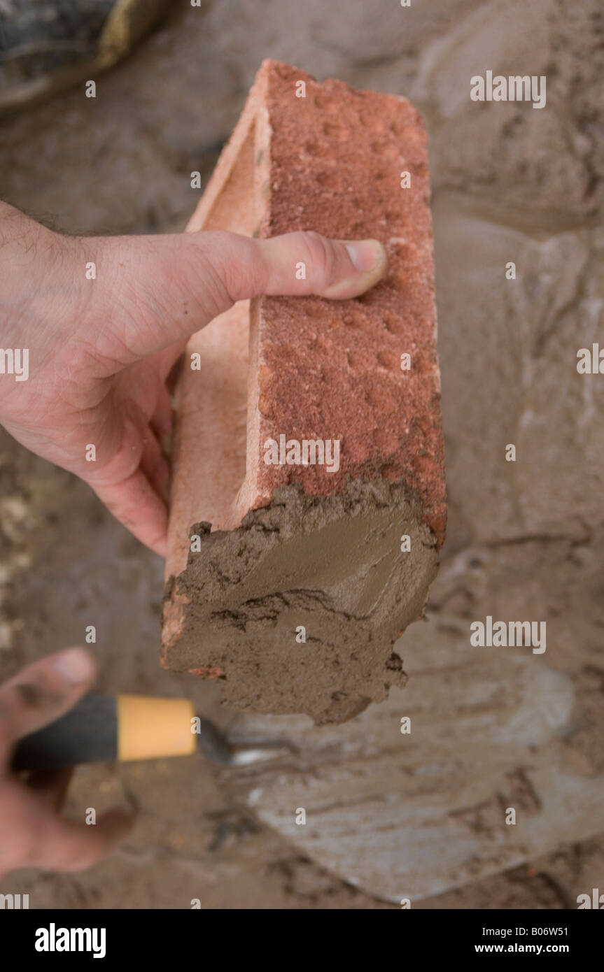 DIY How to build a brick wall Stock Photo - Alamy