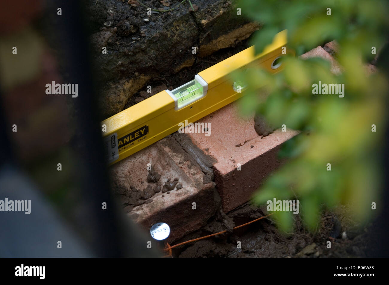 DIY How to build a brick wall Stock Photo - Alamy