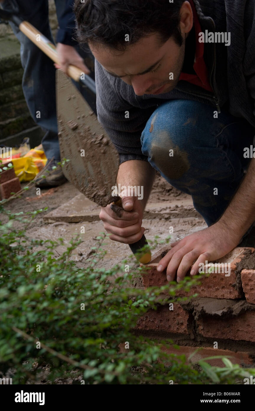 DIY How to build a brick wall Stock Photo - Alamy