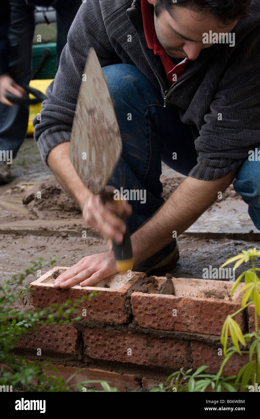 DIY How to build a brick wall Stock Photo - Alamy